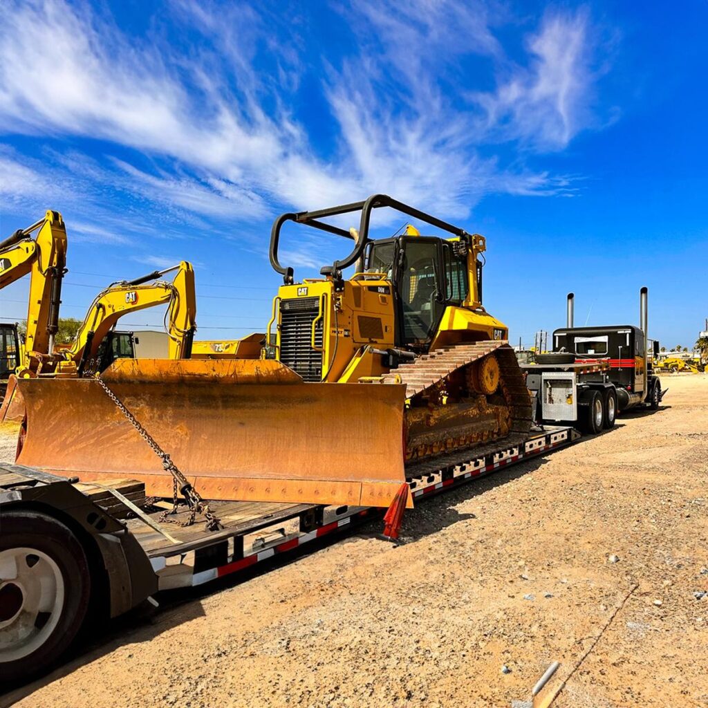 Skid Steer Hauling. Construction Equipment Shipping Company.