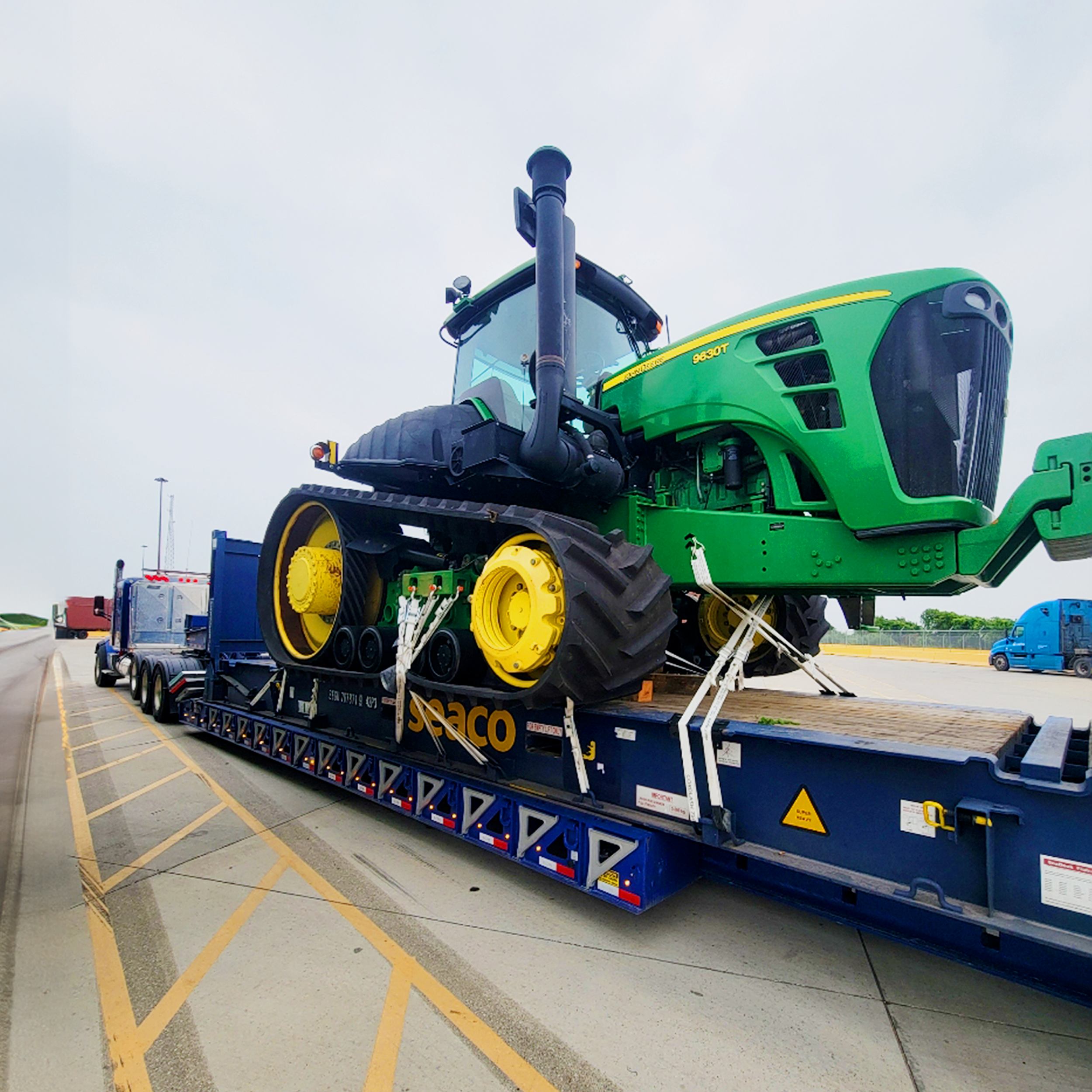 Tractor Transport. Farm Equipment Shipping Company Atlantic Project Cargo